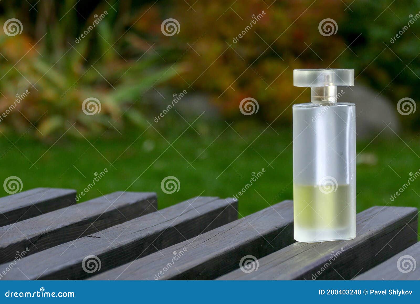 Perfume Bottle on the Bench Stock Photo - Image of cosmetic, bottle ...