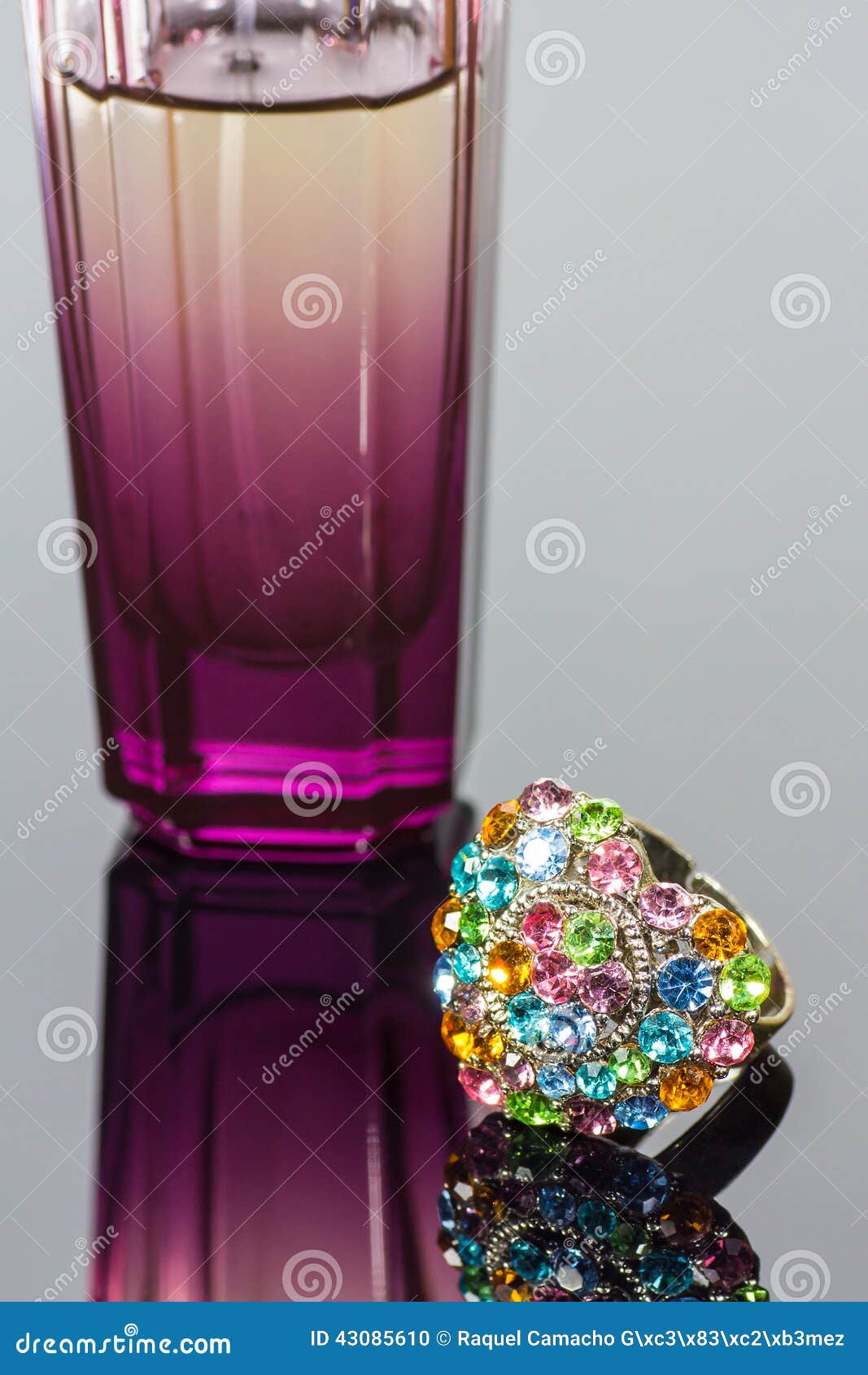 Perfume Bottle and Diamond Ring. Stock Photo - Image of group, ring ...