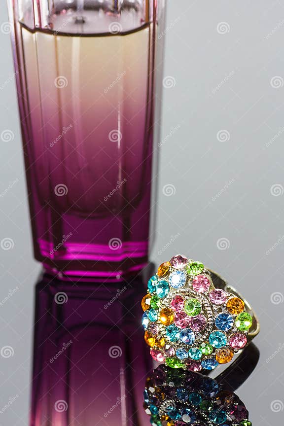 Perfume Bottle and Diamond Ring. Stock Photo - Image of group, ring ...