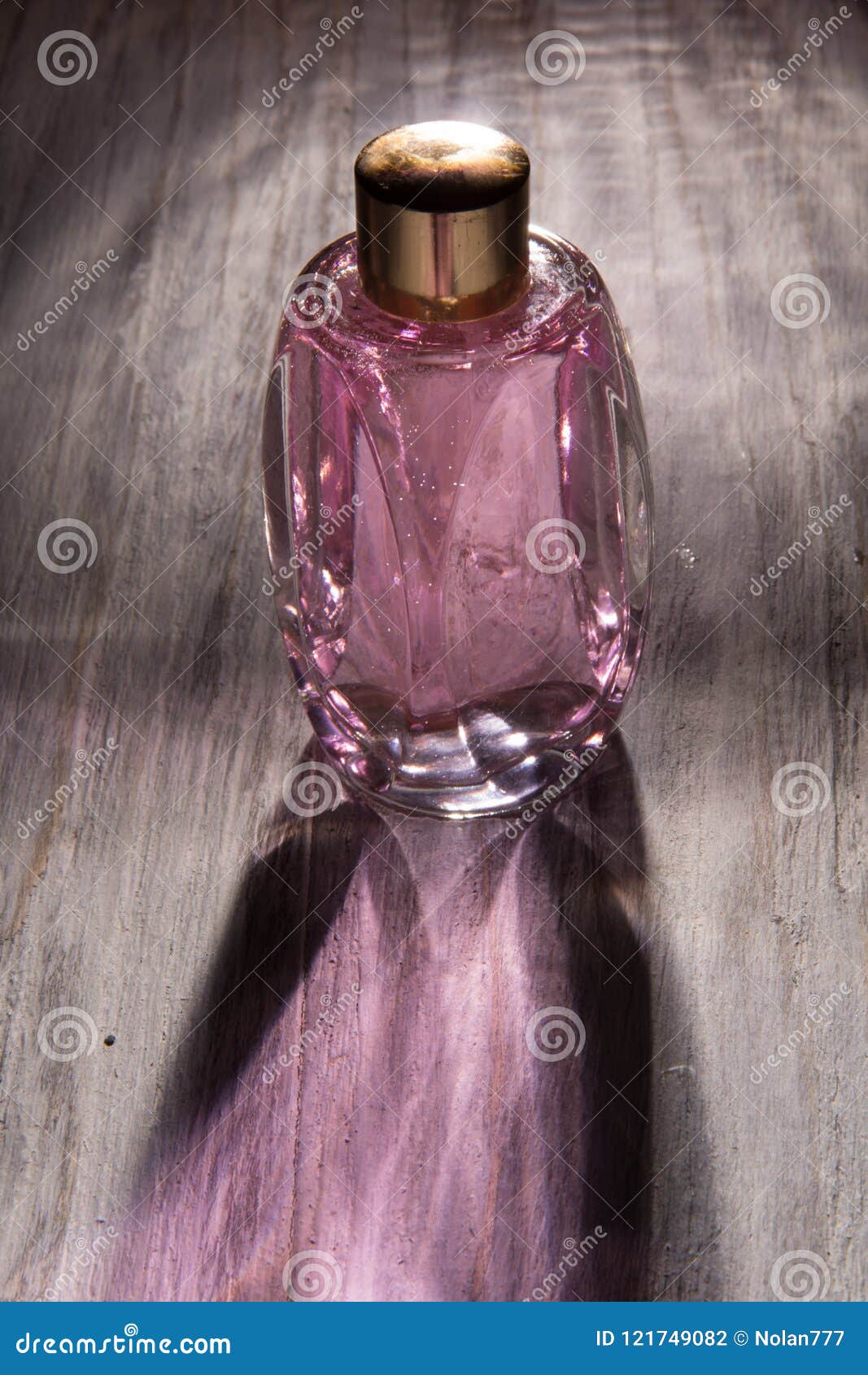 Perfume Bottle and Dramatic Light Stock Photo - Image of essence, aroma ...