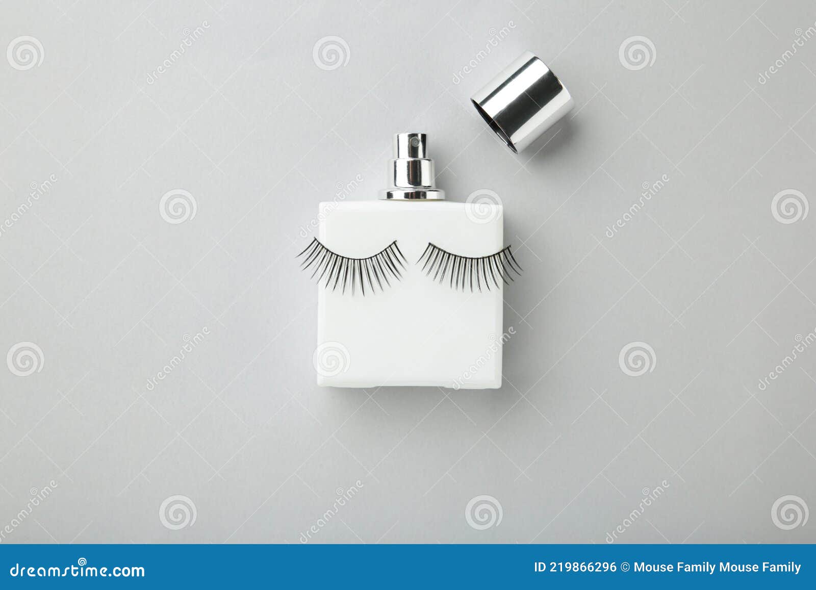Perfume Bottle with Eyelashes on Grey Background Stock Photo - Image of ...