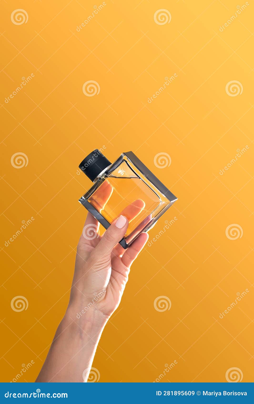 Perfume Bottle in Hands on an Orange Background. Stock Image - Image of ...