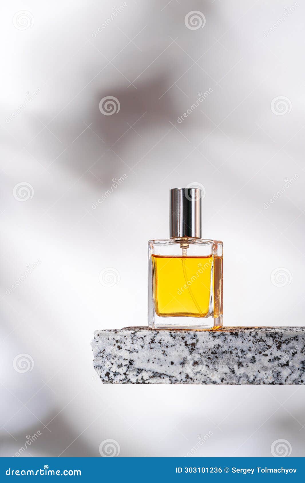 Perfume Bottle on Granite Stones Against White Background with Shadows ...