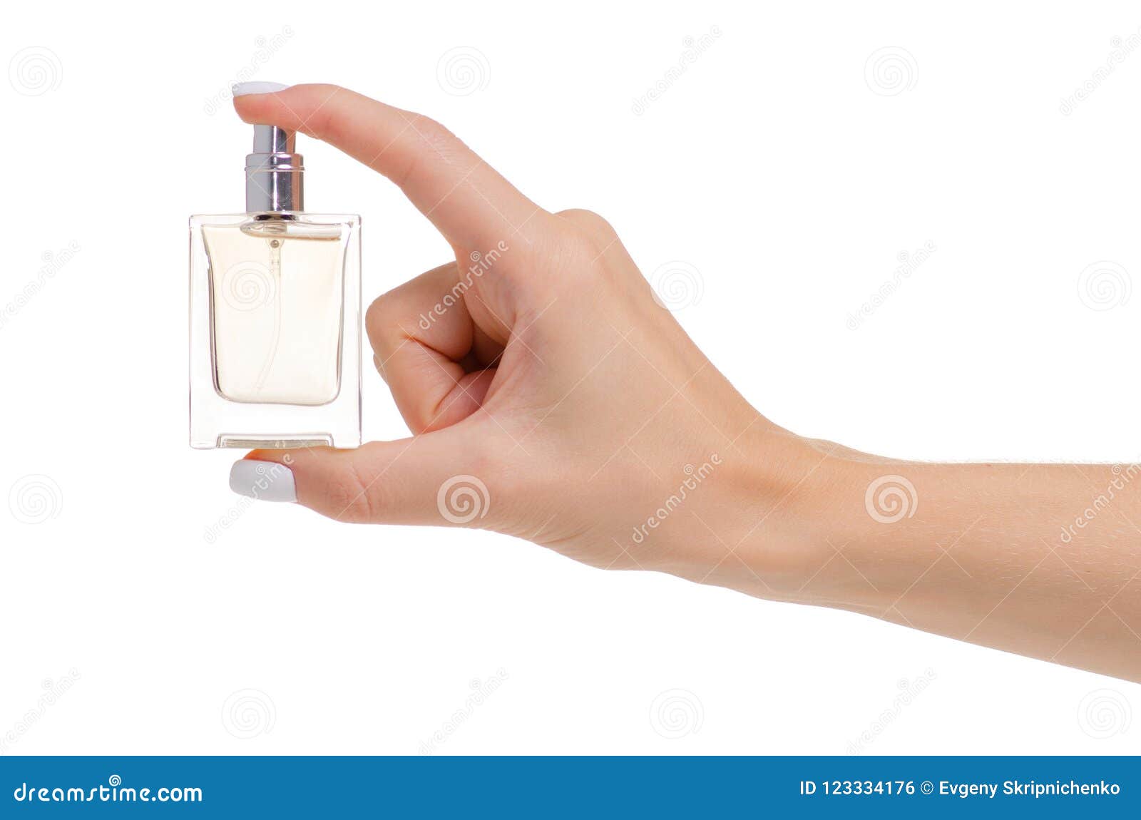 Perfume bottle in hand stock photo. Image of container - 123334176