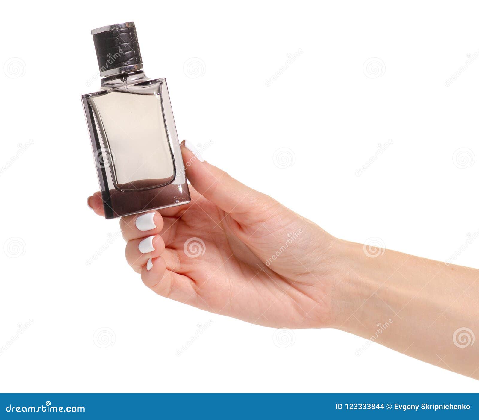 Perfume bottle in hand stock photo. Image of cosmetic - 123333844