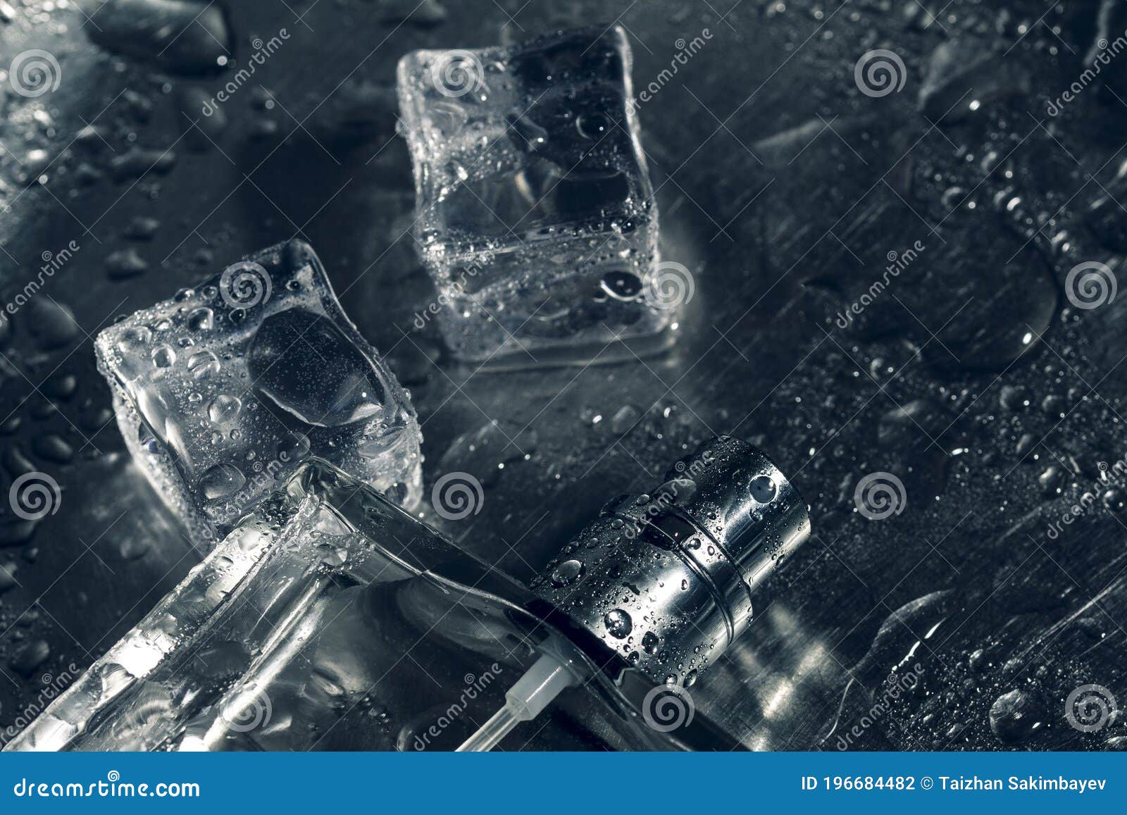 Perfume Bottle Lying on Ice Cubes . Close Up View Stock Photo - Image ...