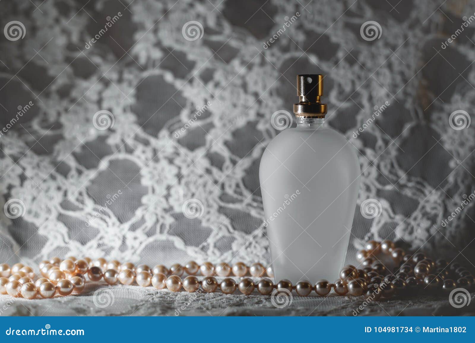 Perfume bottle with pearls stock photo. Image of beauty - 104981734