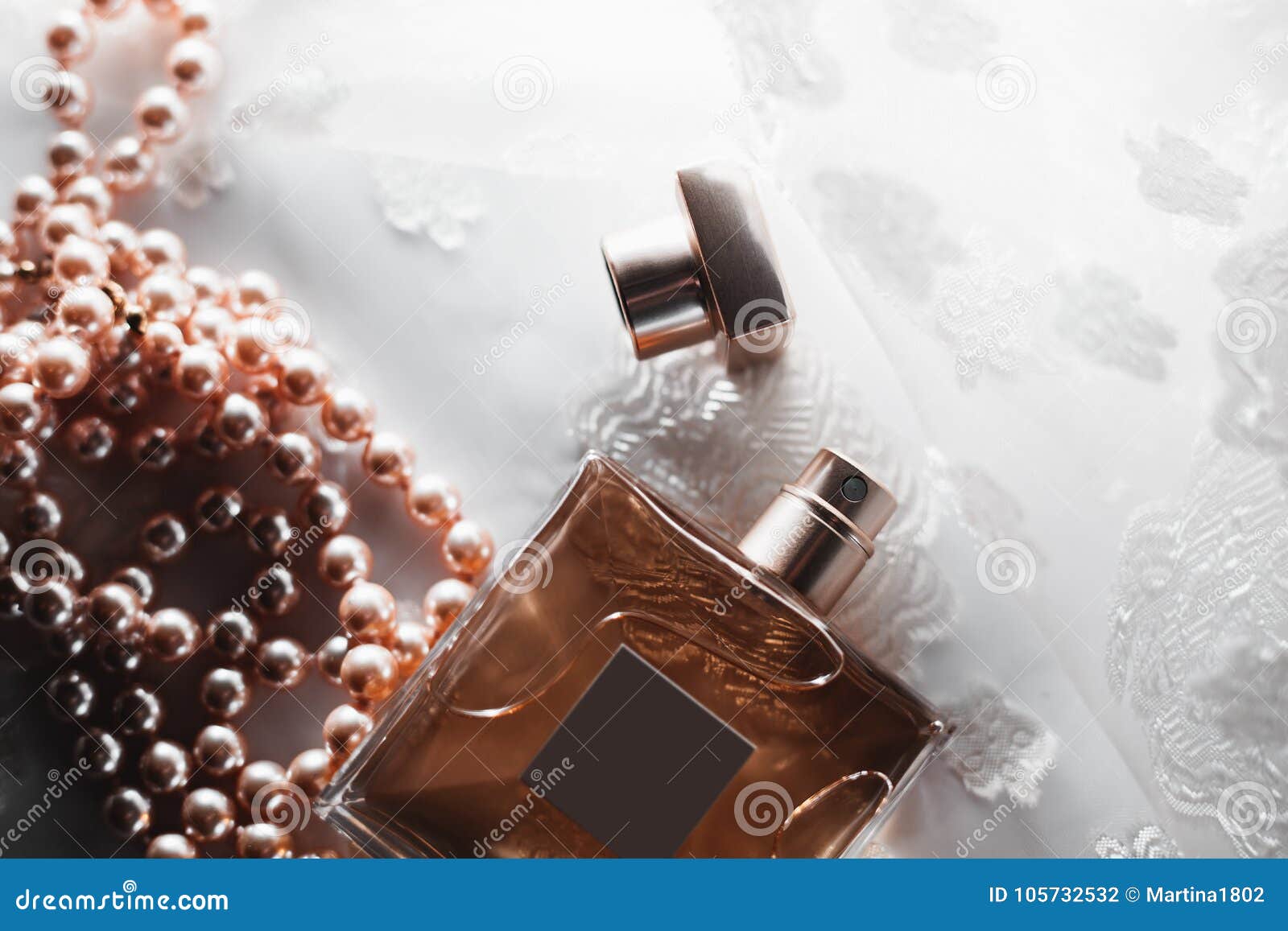 Perfume bottle with pearls stock photo. Image of deodorant - 105732532