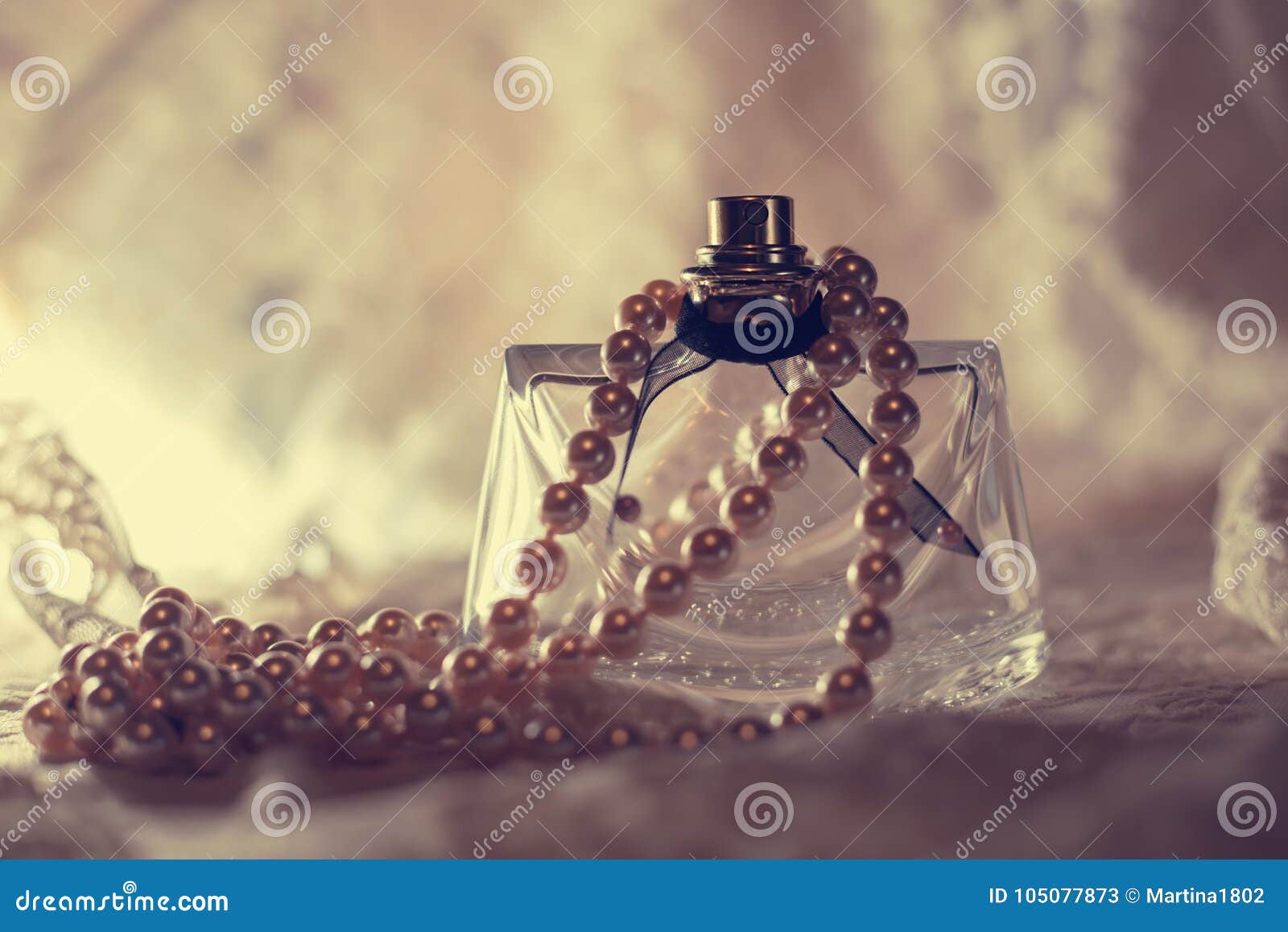 Perfume bottle with pearls stock image. Image of fabric - 105077873