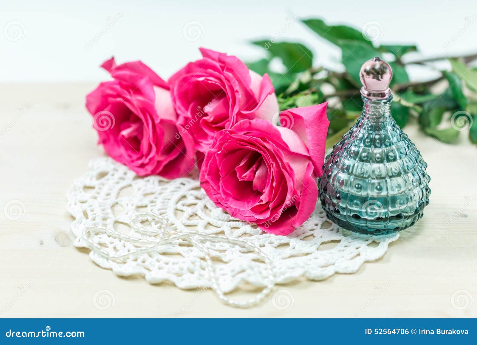 Perfume bottle with roses stock photo. Image of essence - 52564706