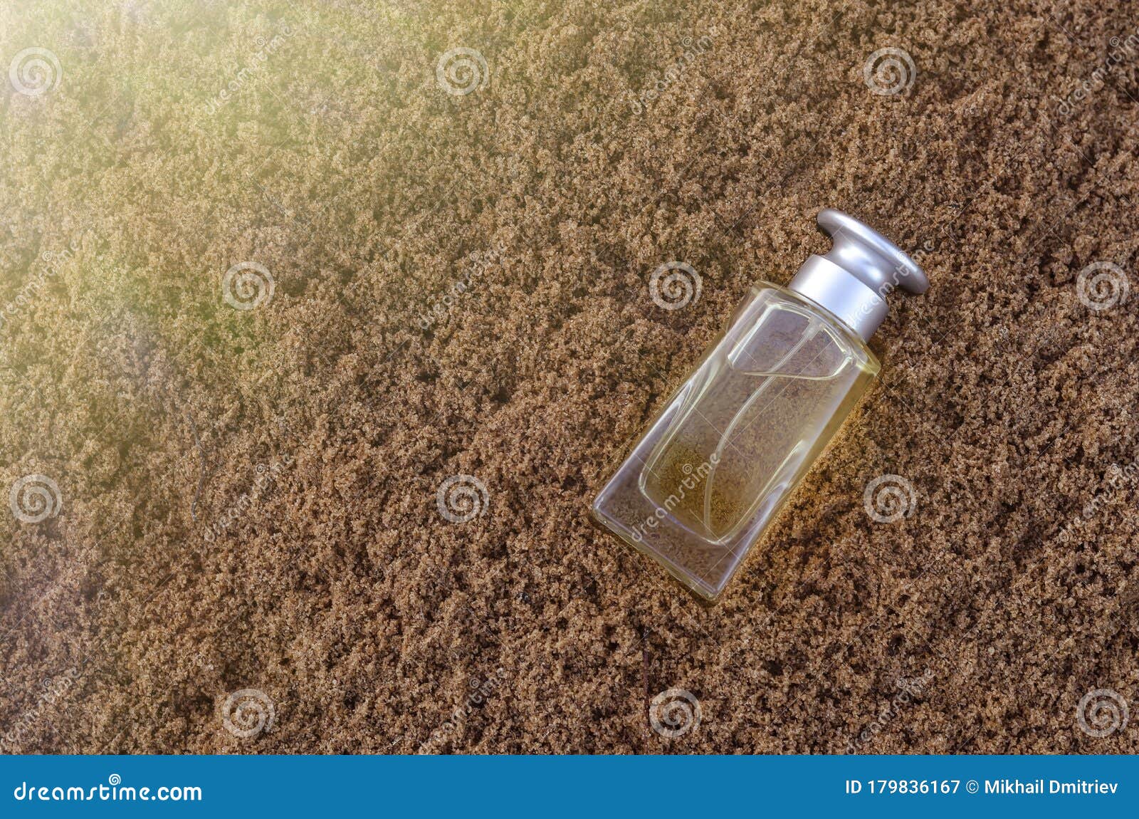 Perfume bottle on the sand stock image. Image of fragrance - 179836167
