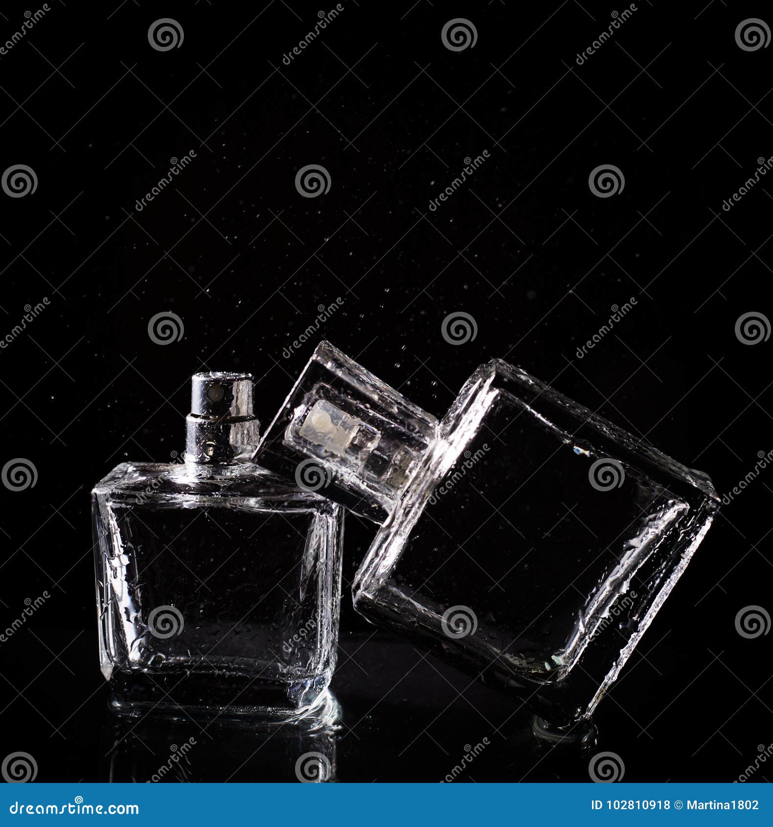 Perfume bottle with splash stock photo. Image of drop - 102810918