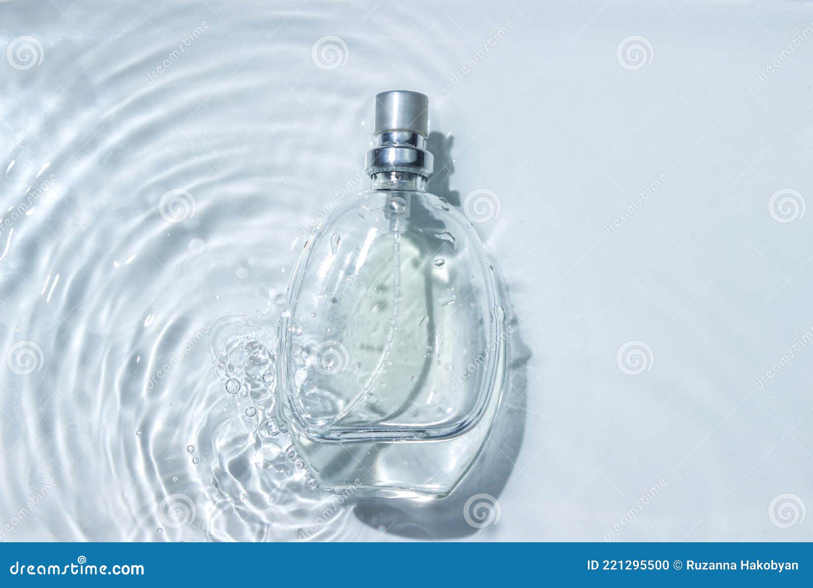 Perfume Bottle on the Surface of the Water. Circle Ripples on Water ...