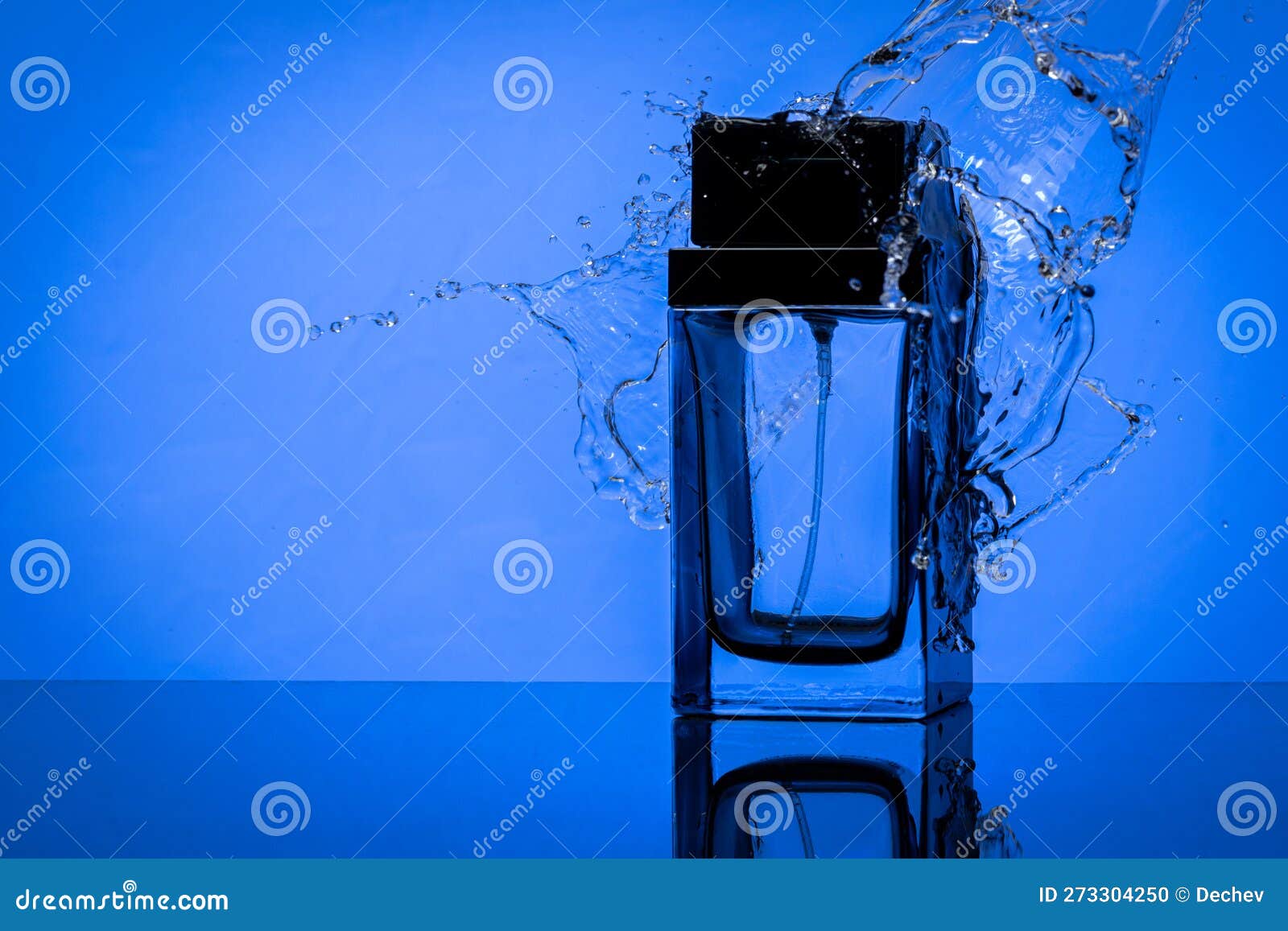 Perfume Bottle and Water Splash Around it, on Blue Background. Mockup ...