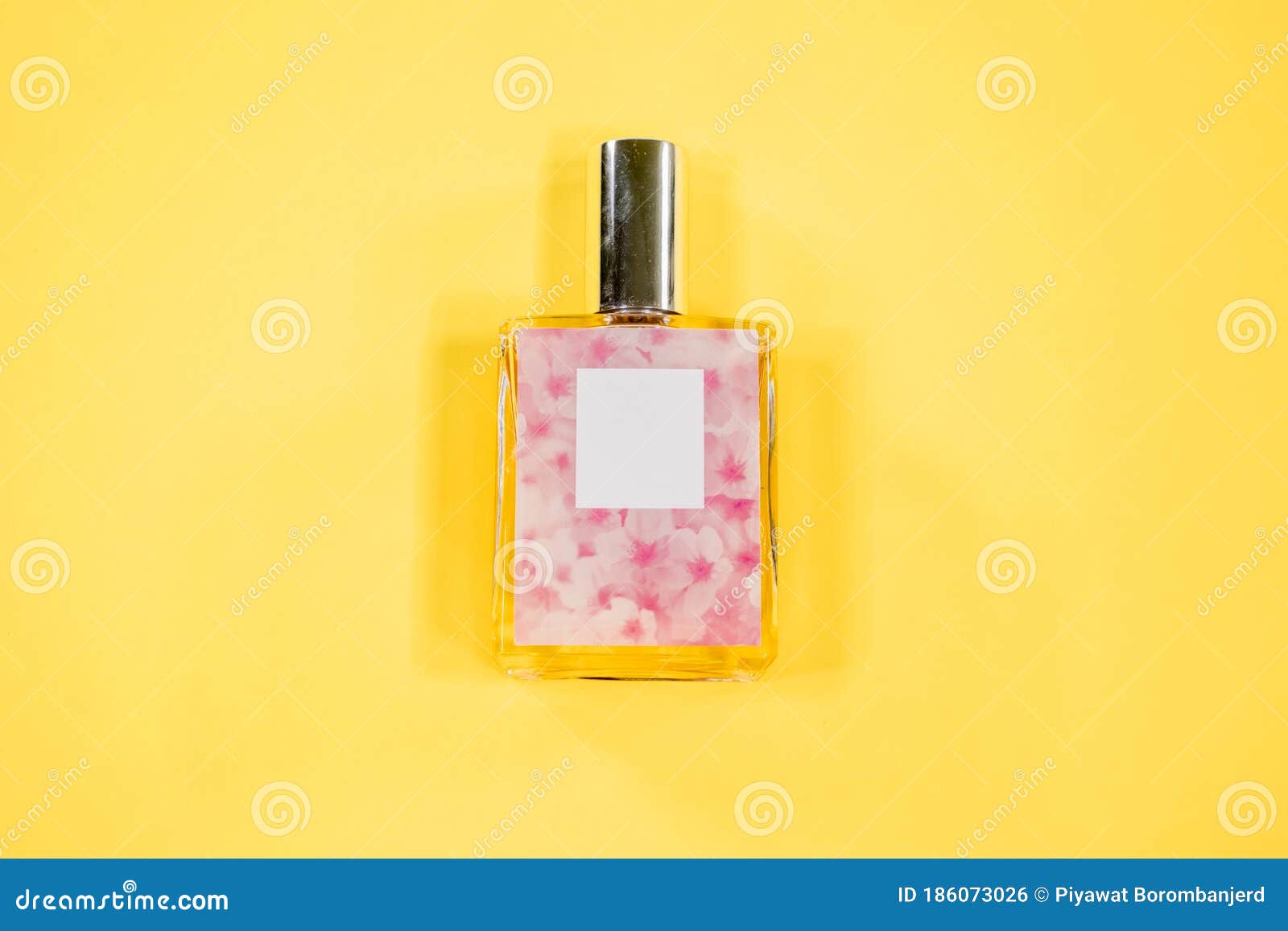 Perfume Bottle on Yellow Background Stock Photo - Image of transparent ...