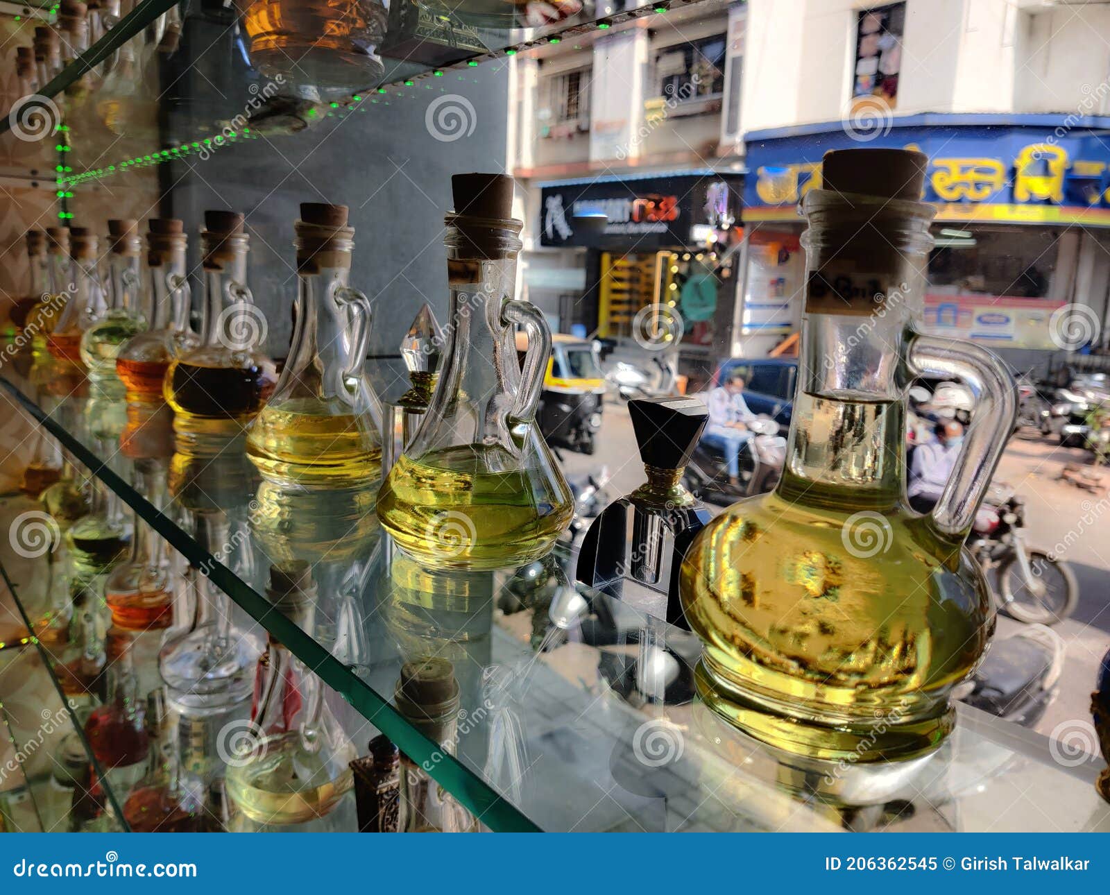 Perfume Bottles for Display on Glass Racks Attractive Bottles Stock ...