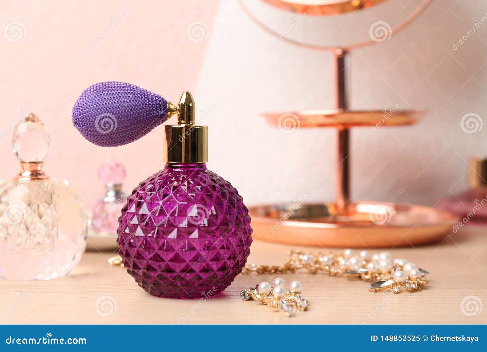 Perfume Bottles and Jewellery on Table Stock Image - Image of glamour ...