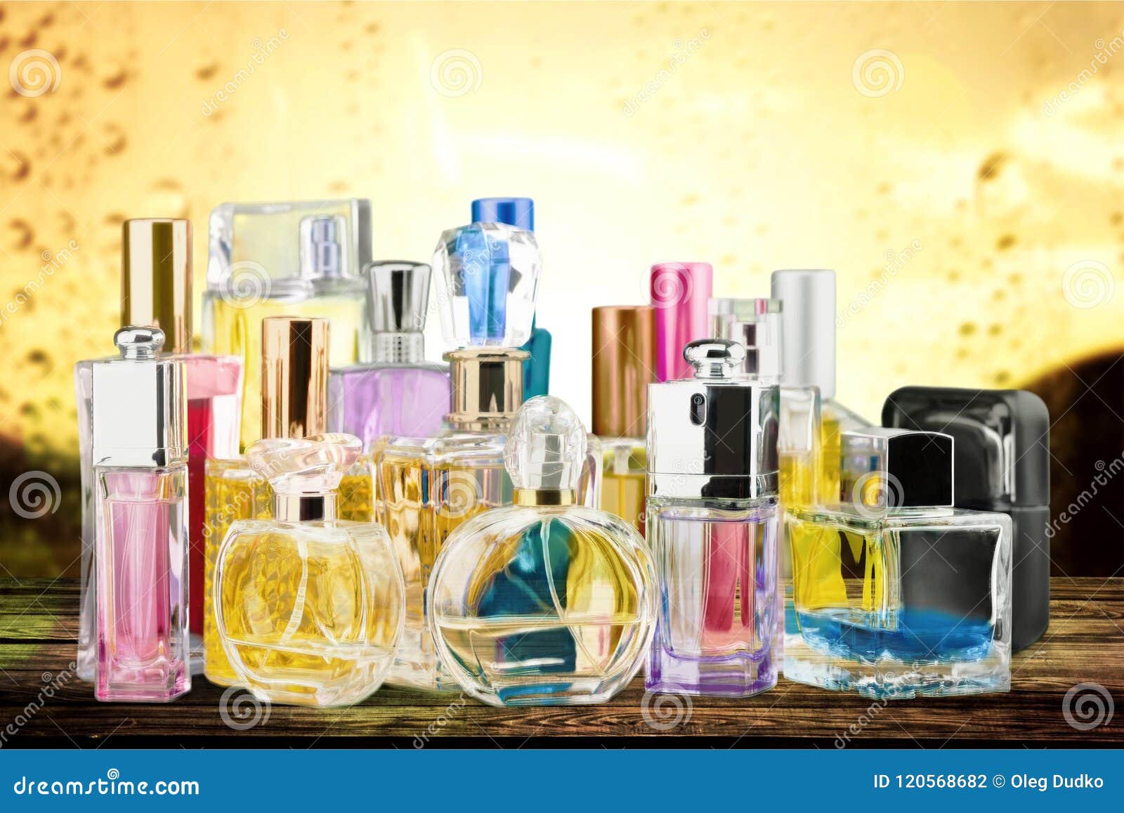 Perfume bottles on table stock photo. Image of container - 120568682
