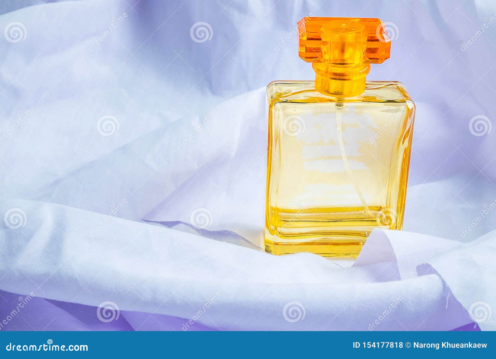 .Perfume and Perfume Bottles on a White Cloth Floor Stock Photo - Image ...