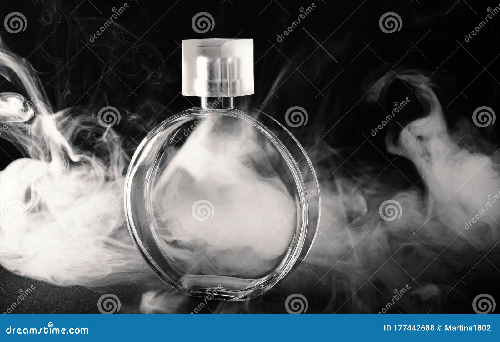 Perfume in dense smoke stock photo. Image of background - 177442688