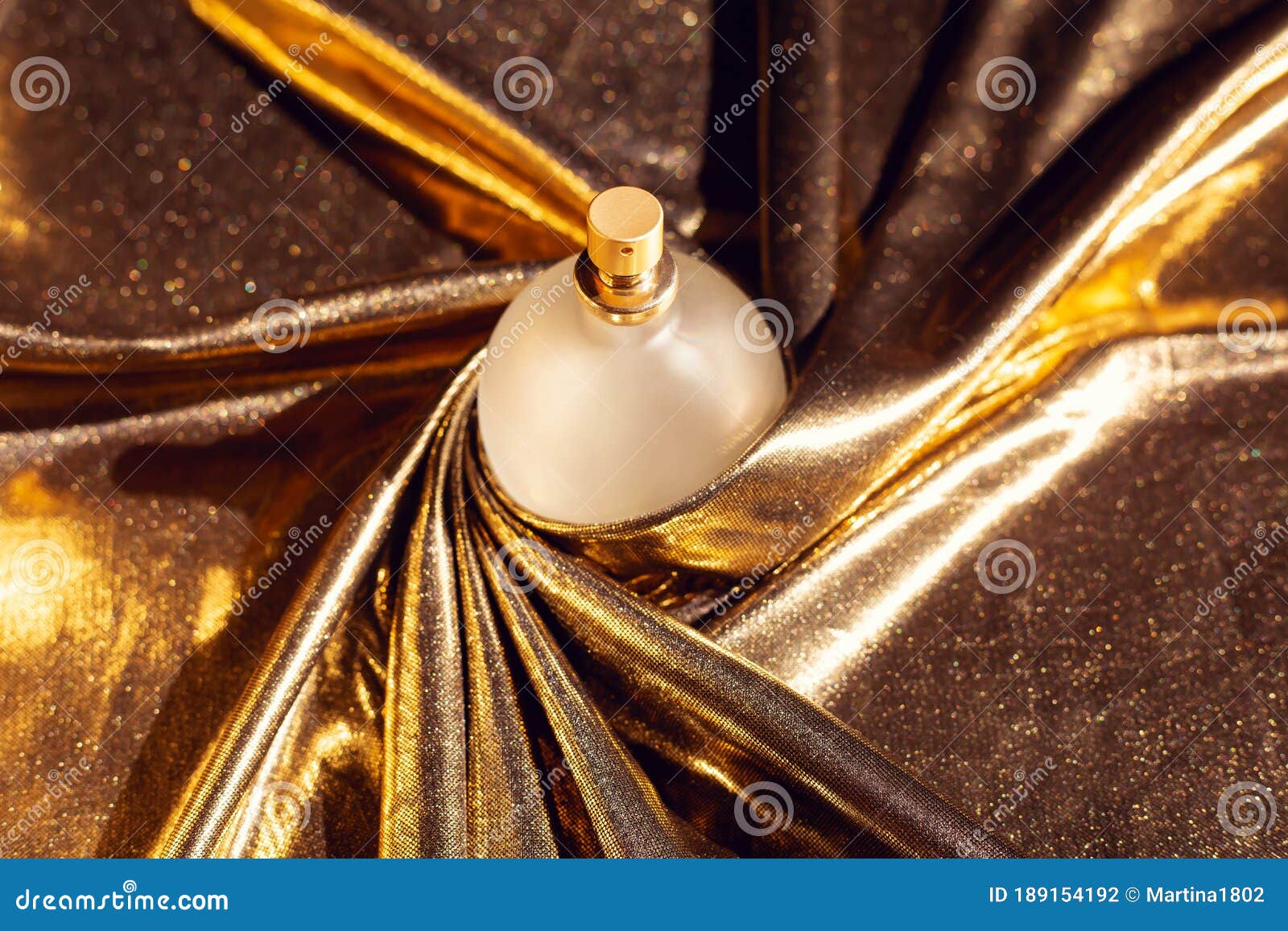 Perfume on gold background stock photo. Image of accessories - 189154192