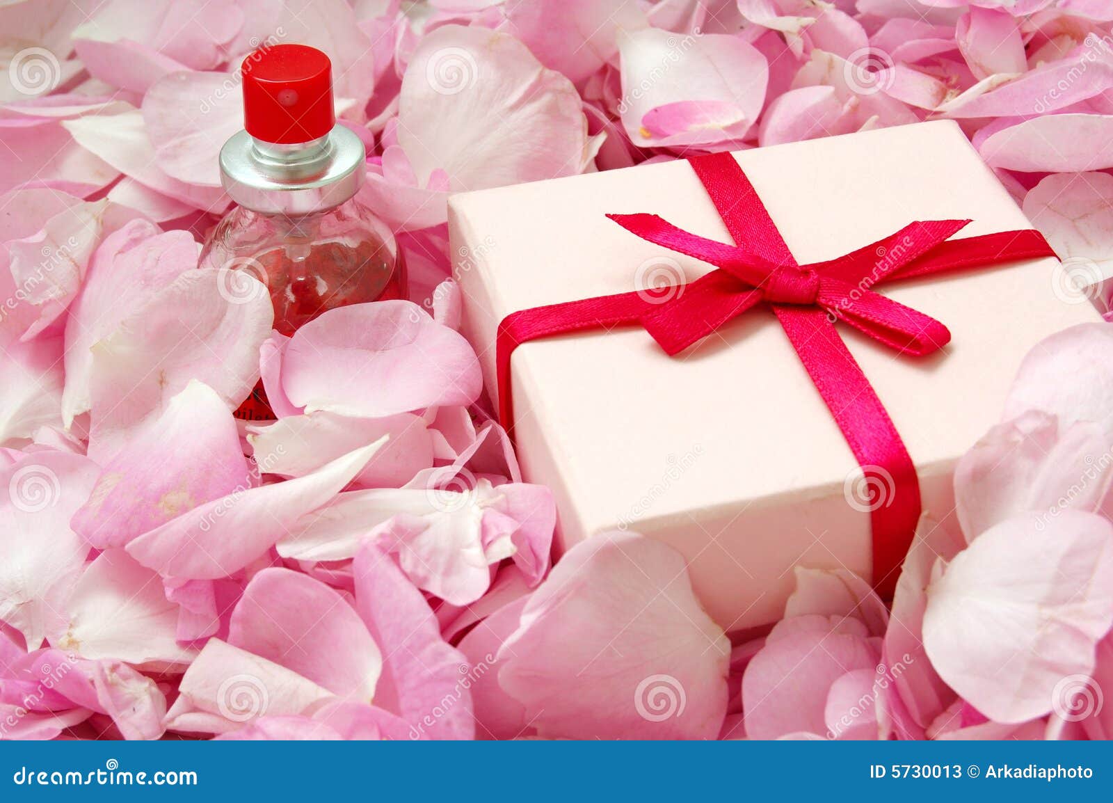 Perfume in rose petals stock image. Image of gift, white - 5730013