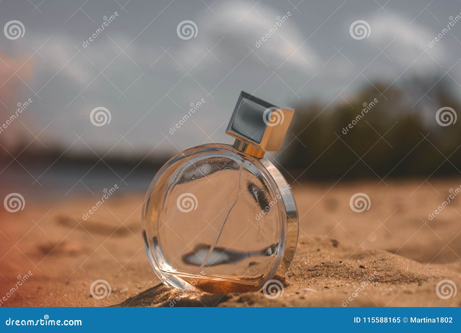 Perfume on the sand stock image. Image of skincare, glass - 115588165