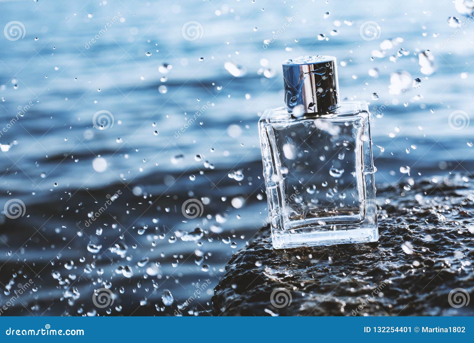 Perfume on blue background stock image. Image of summer - 132254401