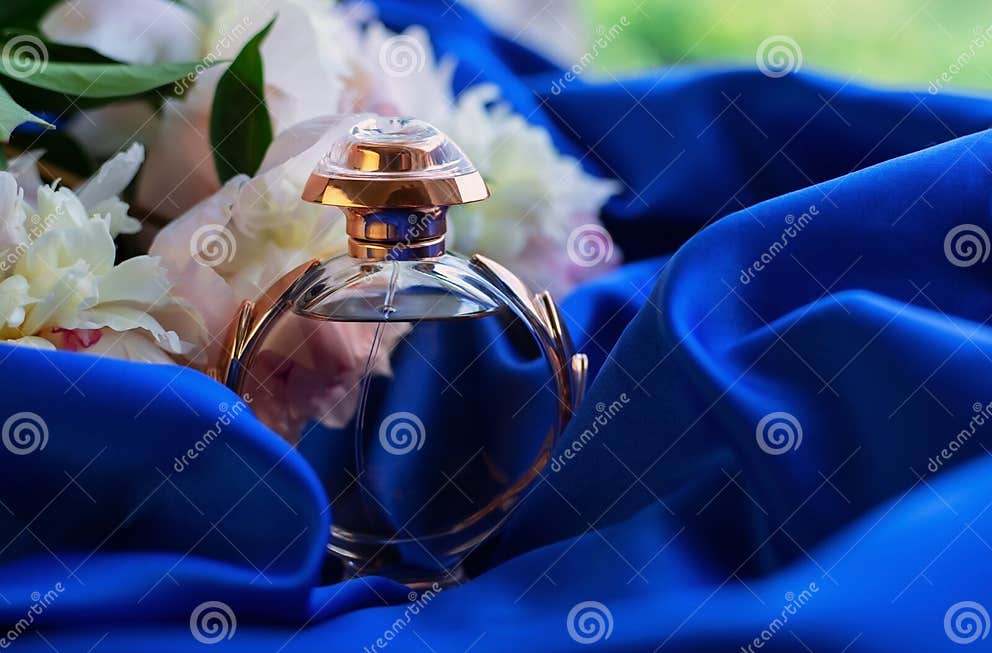 Perfume and spring flowers stock image. Image of decoration - 326923331