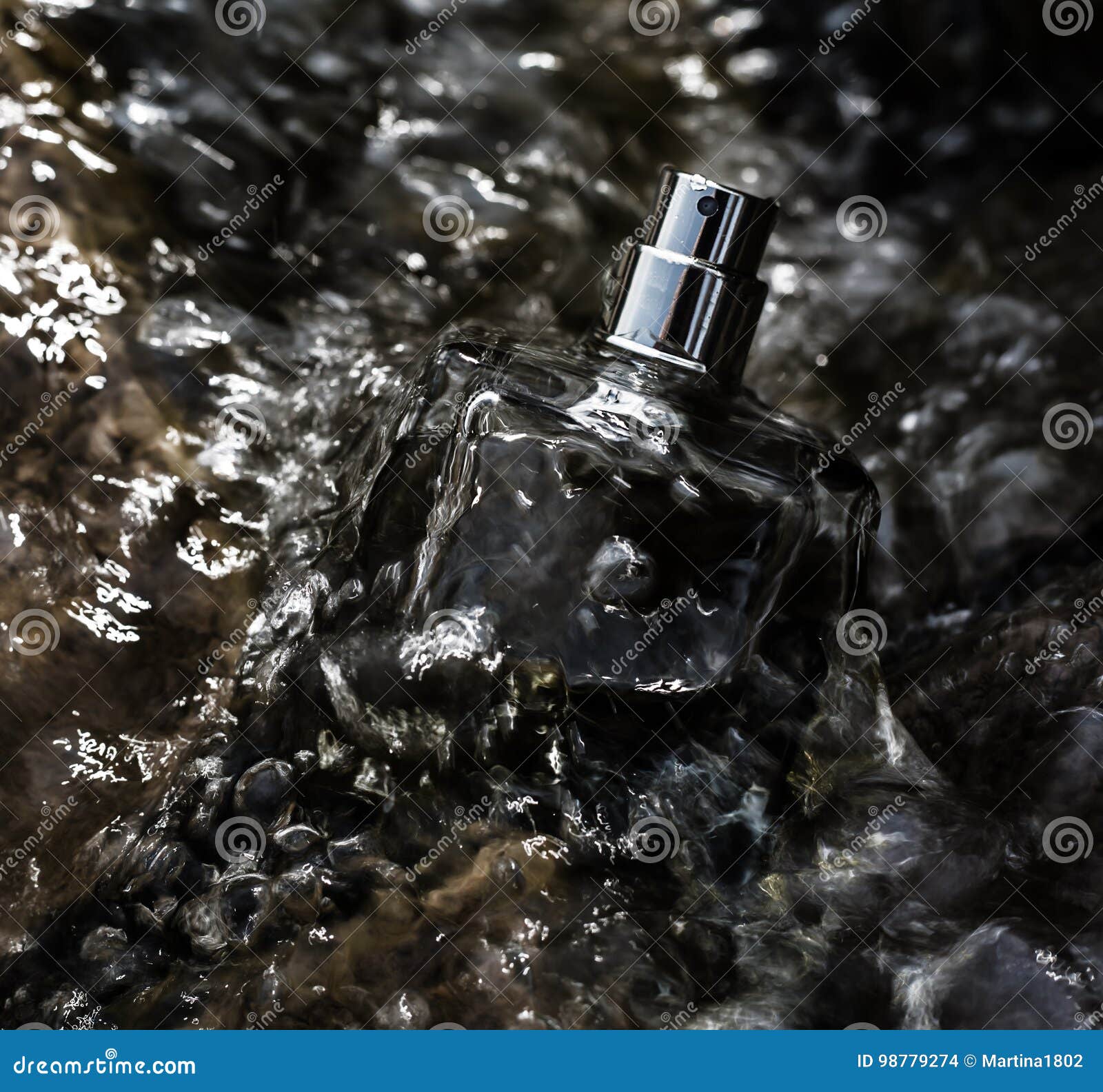 Perfume on water splash stock photo. Image of colour - 98779274