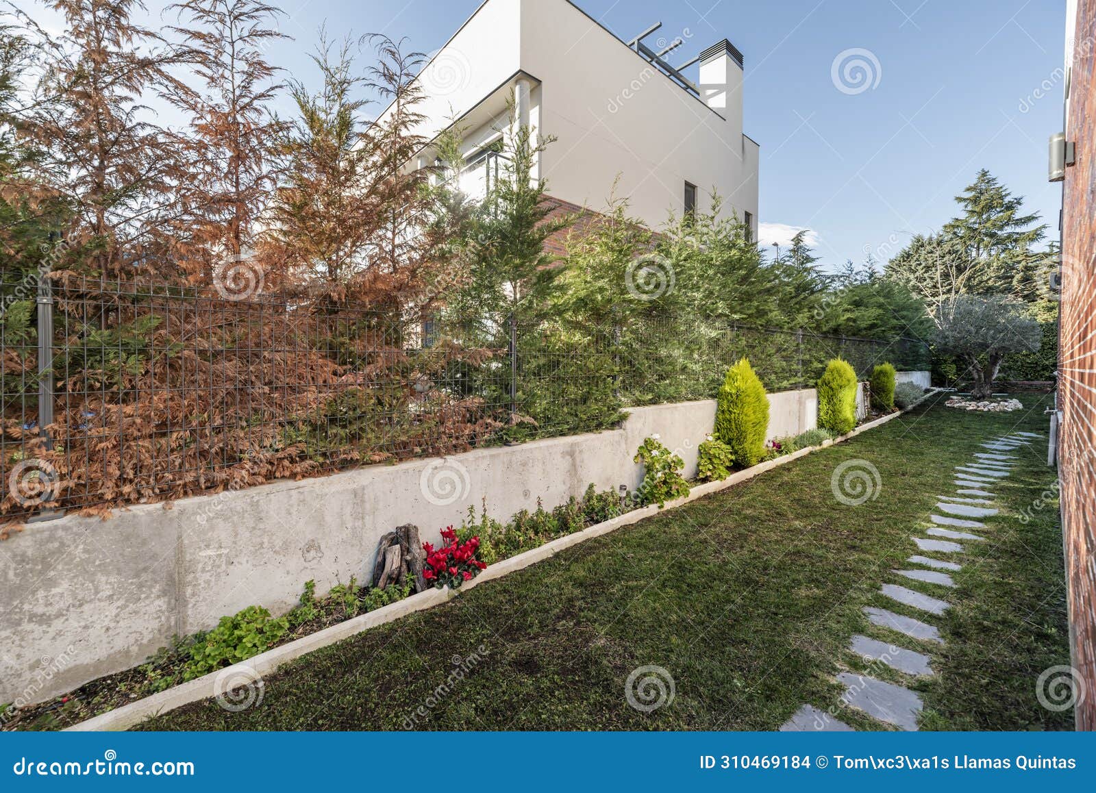 Perimeter Garden With A Tiled Path Around A Detached House With Brick ...