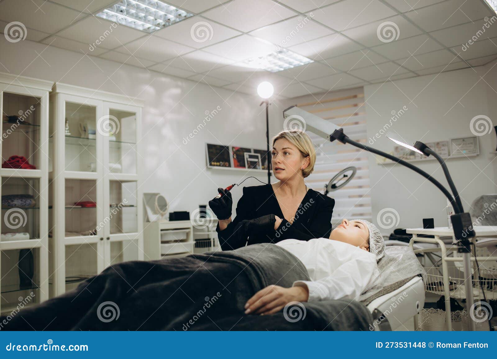 Permanent Makeup on Eyebrows by Professional Cosmetologist. Stock Photo ...