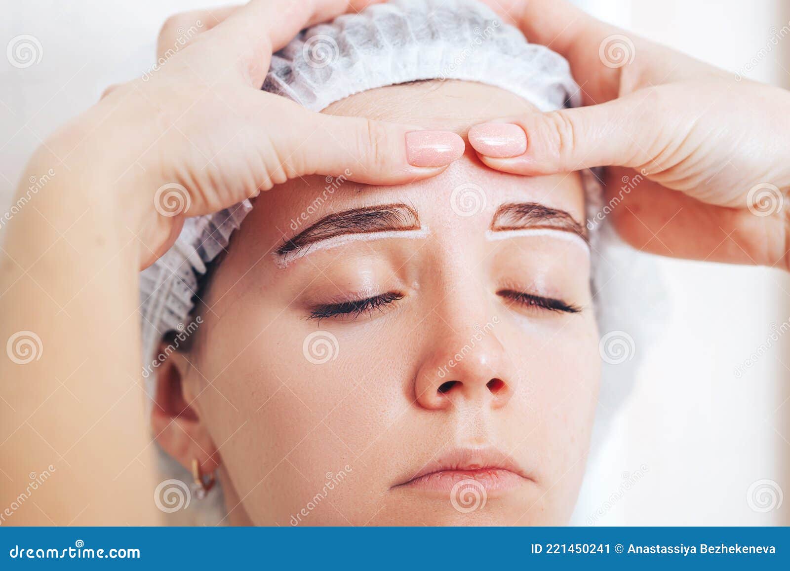 A Permanent Makeup Master Checking the Symmetry of the Eyebrow Markings ...