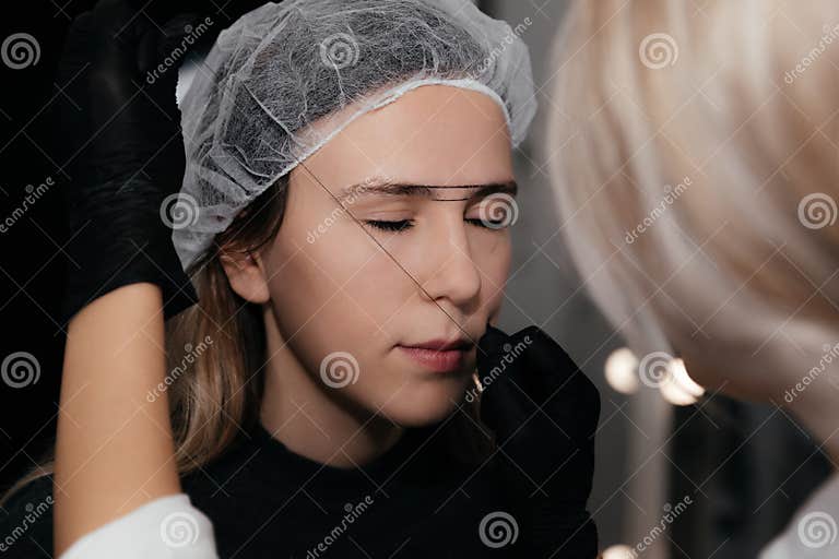 Permanent Master Draws Lines with Thread on Client Face, Makes a Sketch ...