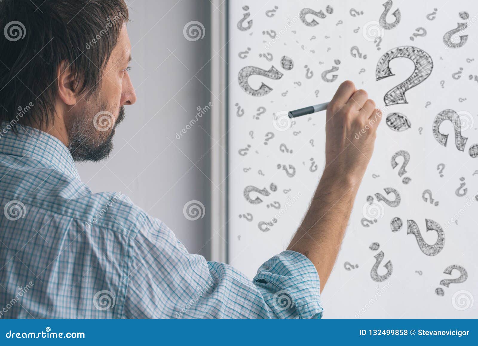Perplexed Businessman Drawing Question Marks on Whiteboard Stock Photo ...