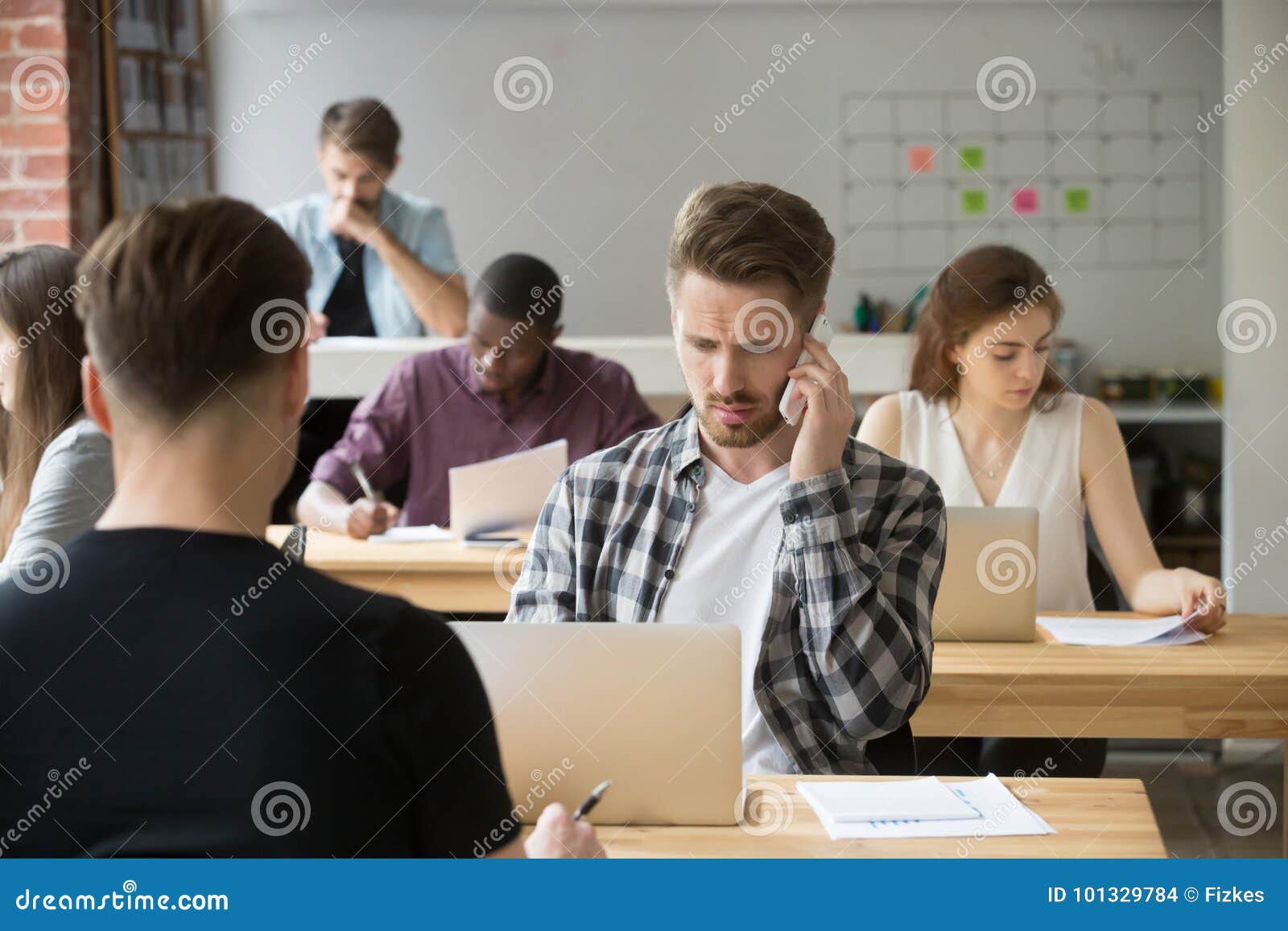 Perplexed Casual Entrepreneur Making Phone Call at Workplace. Stock ...