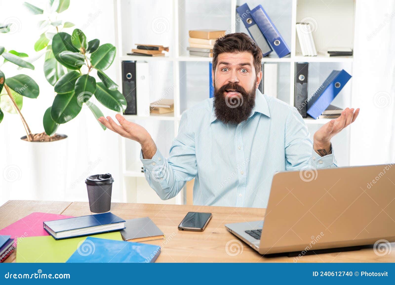 Perplexed Guy Making Helpless Gesture Working at Office Desk ...