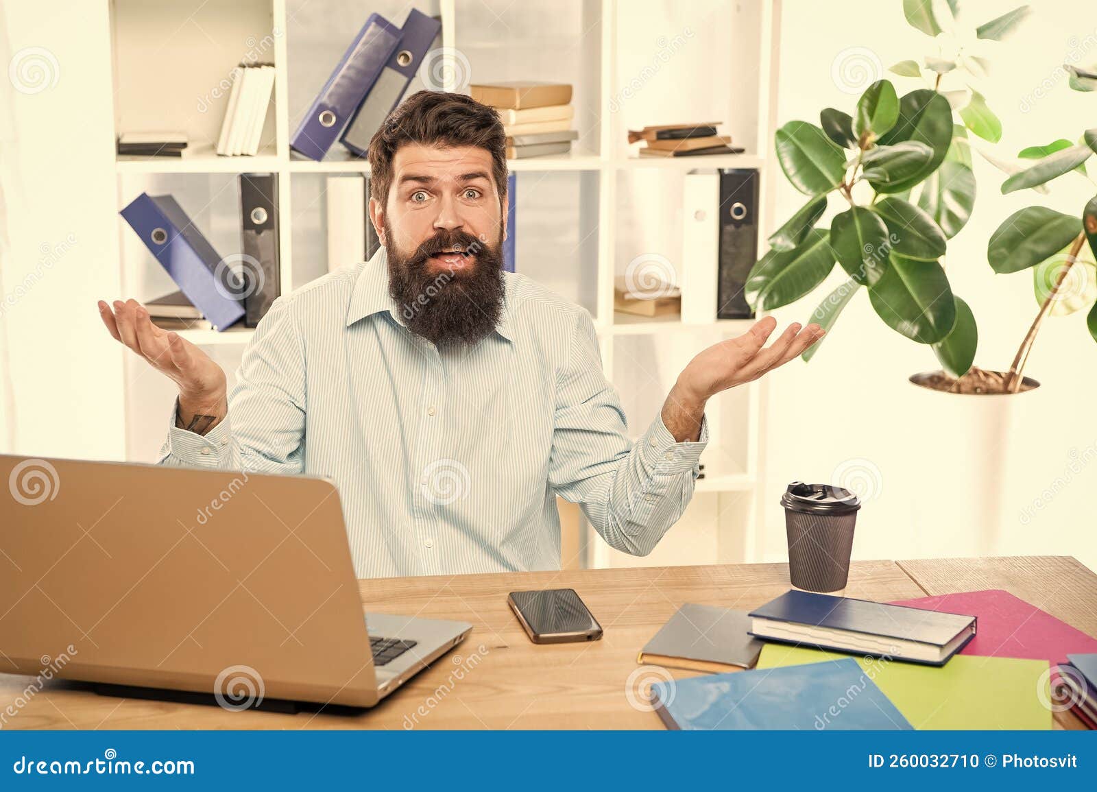 Perplexed Guy Making Helpless Gesture Working at Office Desk ...