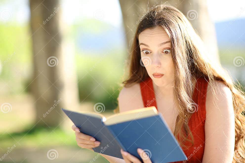Perplexed Reader Reading a Paper Book Outdoors Stock Image - Image of ...