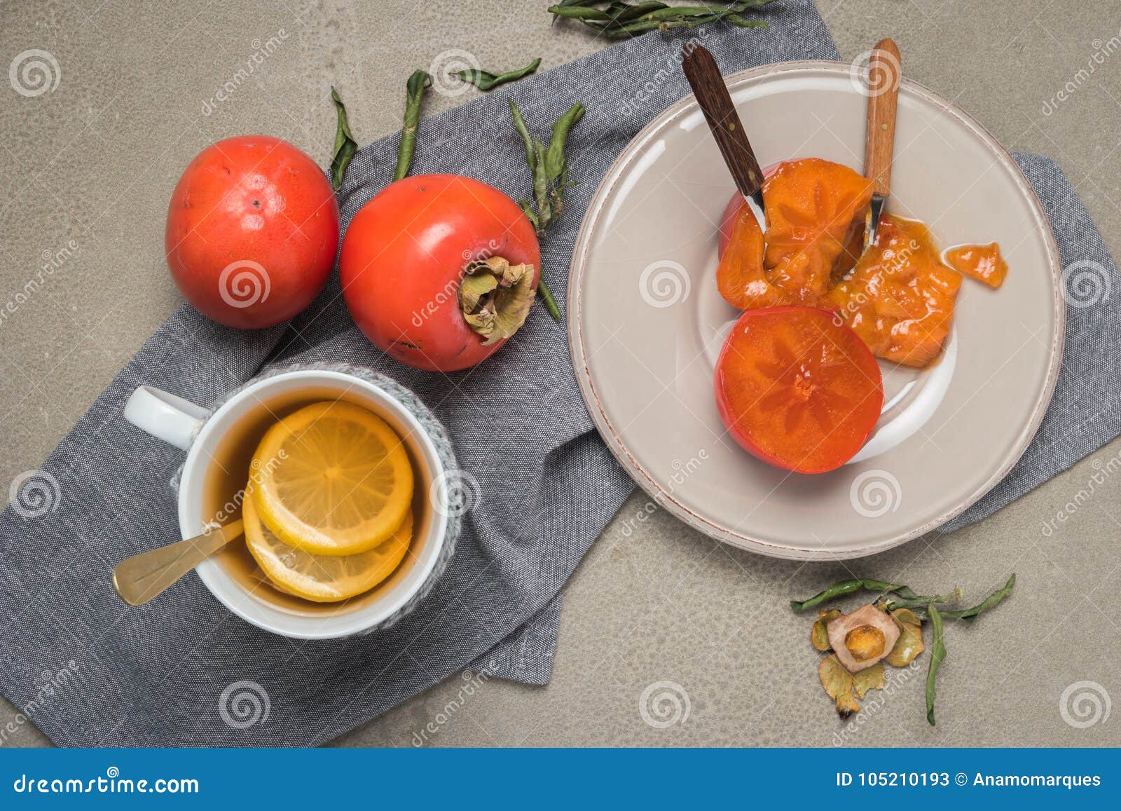 Persimmon Fruit on the Plate and Lemon Tea. Rustic Background in Stock ...