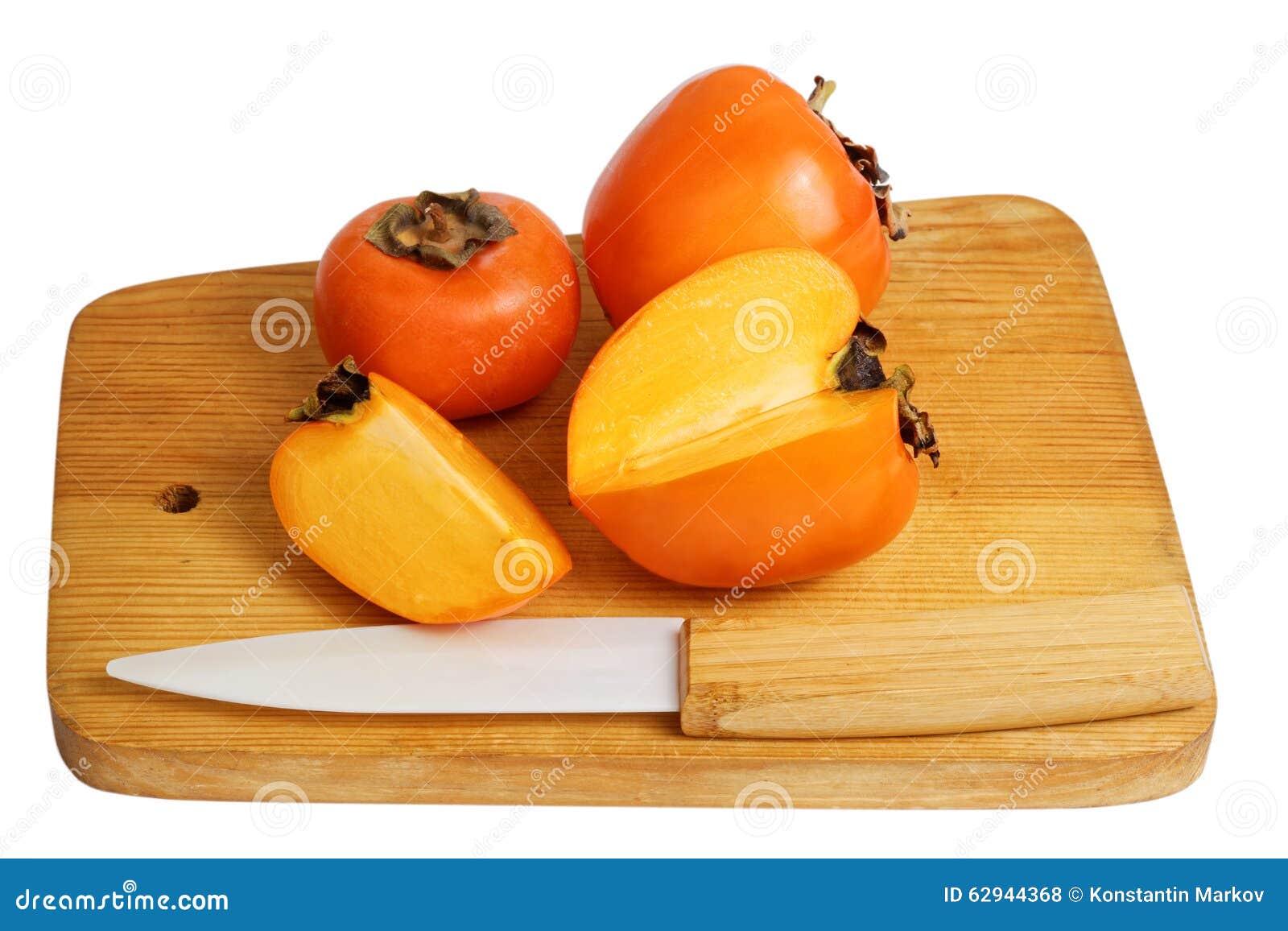 Persimmons on Wooden Kitchen Cutting Board Stock Photo - Image of ...