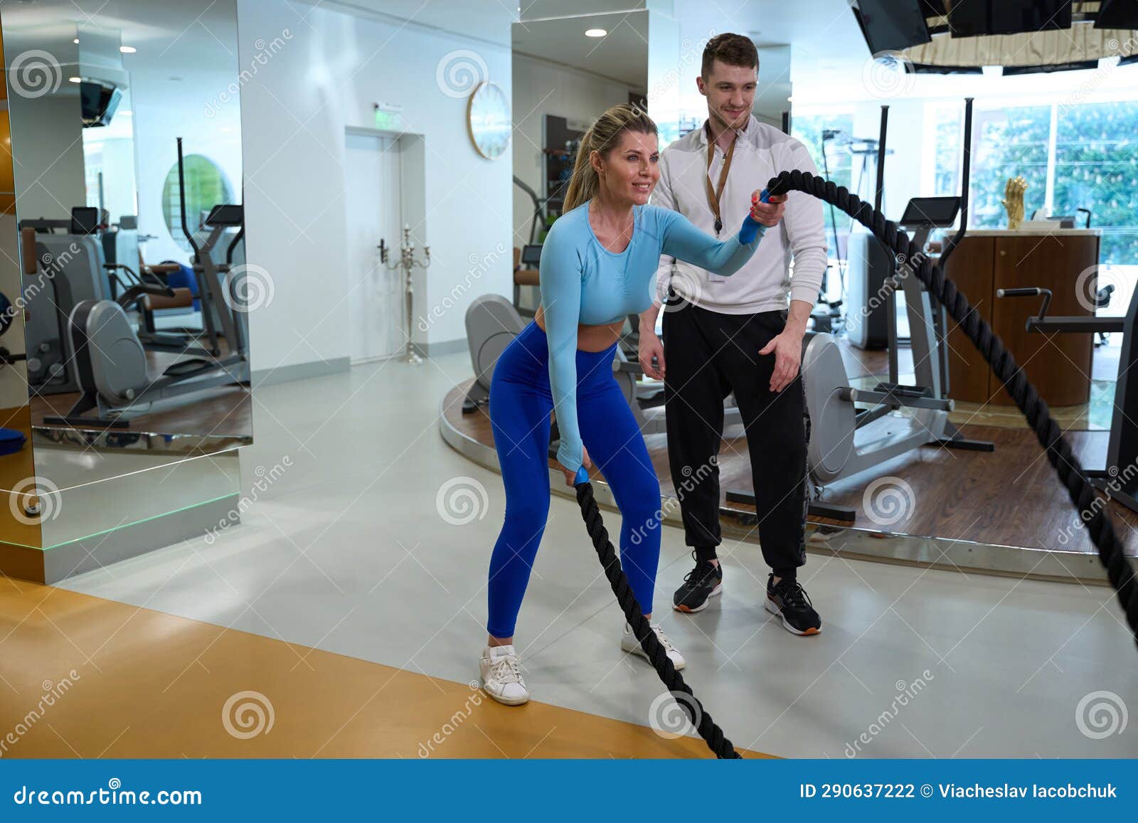 Persistent Woman Using Battle Ropes for Intense Strength-building ...