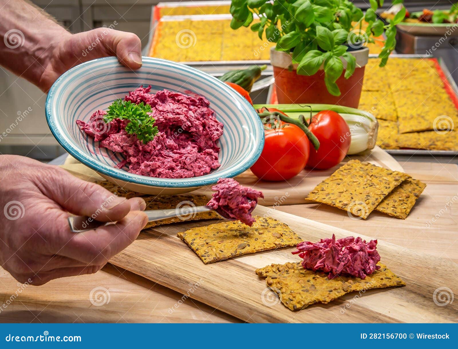 Person Adding a Topping on Crispbread in the Kitchen. Stock Photo ...