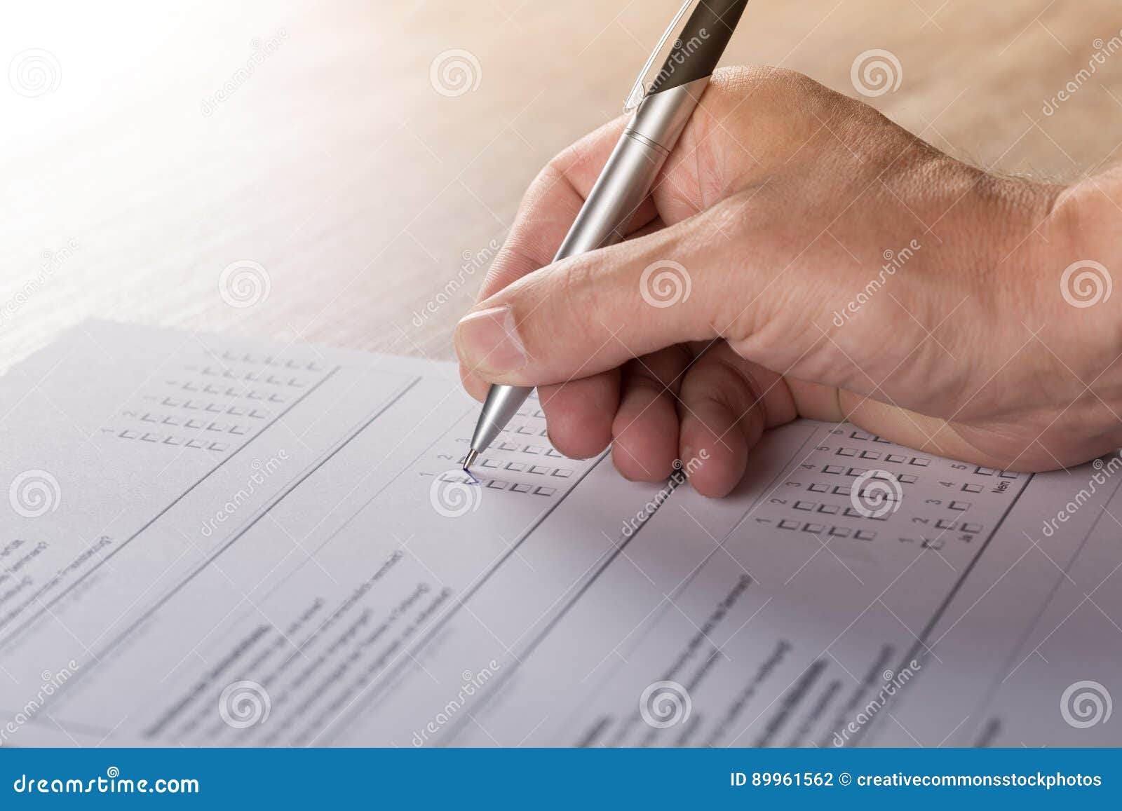 Person Answering Test Paper Picture. Image: 89961562