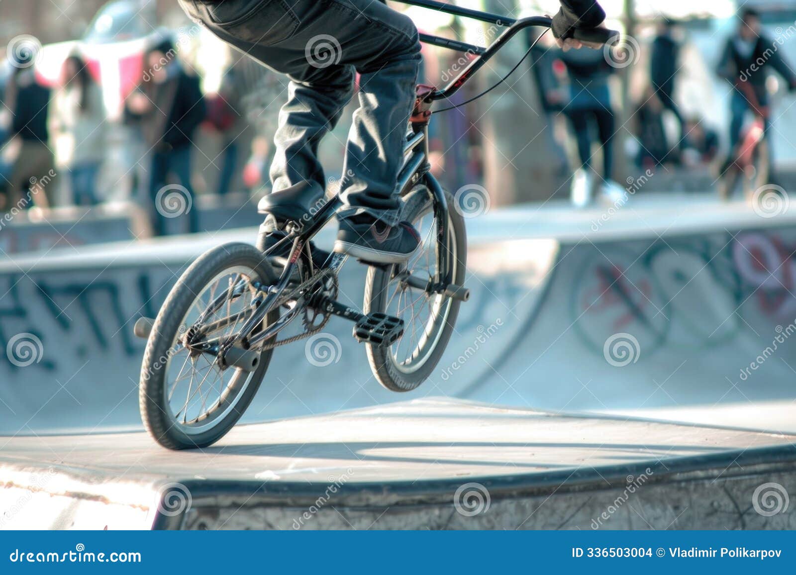 A Person on a Bicycle Climbing Up an Inclined Surface, Possibly for ...