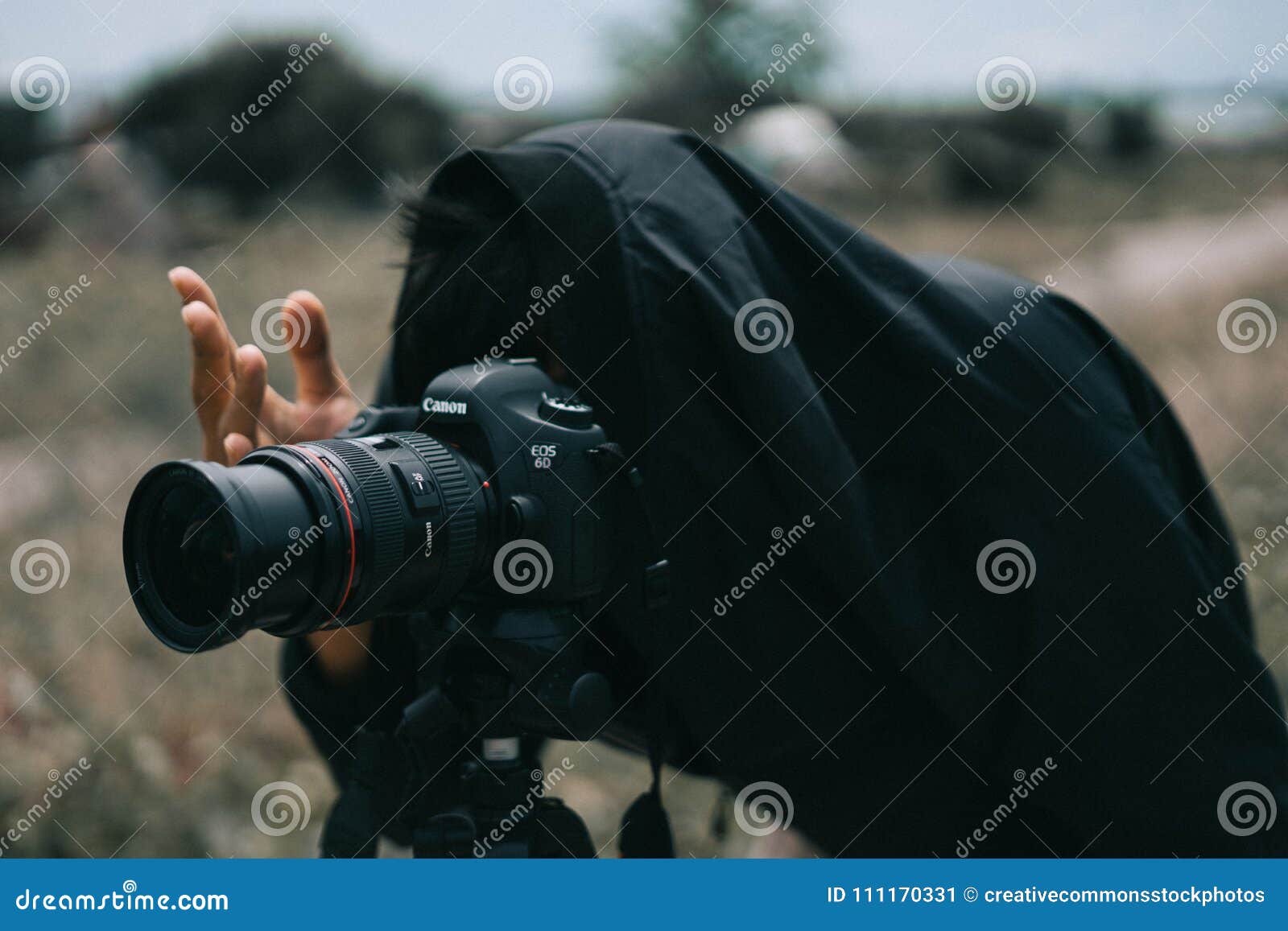 Person In Black Jacket Facing Black Canon Dslr Camera Picture. Image ...