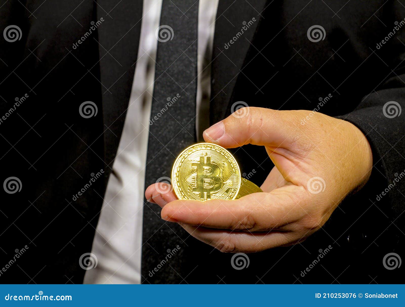 Person in Black Suit Holding a Bitcoin Stock Photo - Image of economic ...