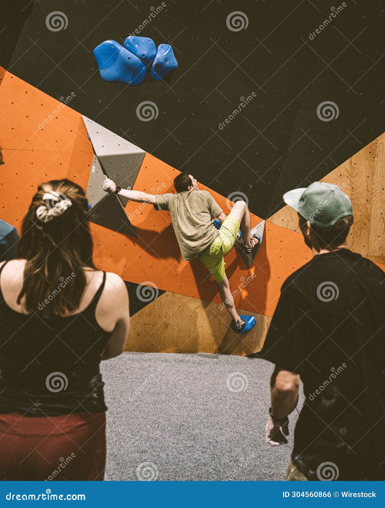 Person Bouldering on an Indoor Climbing Wall Stock Photo - Image of ...