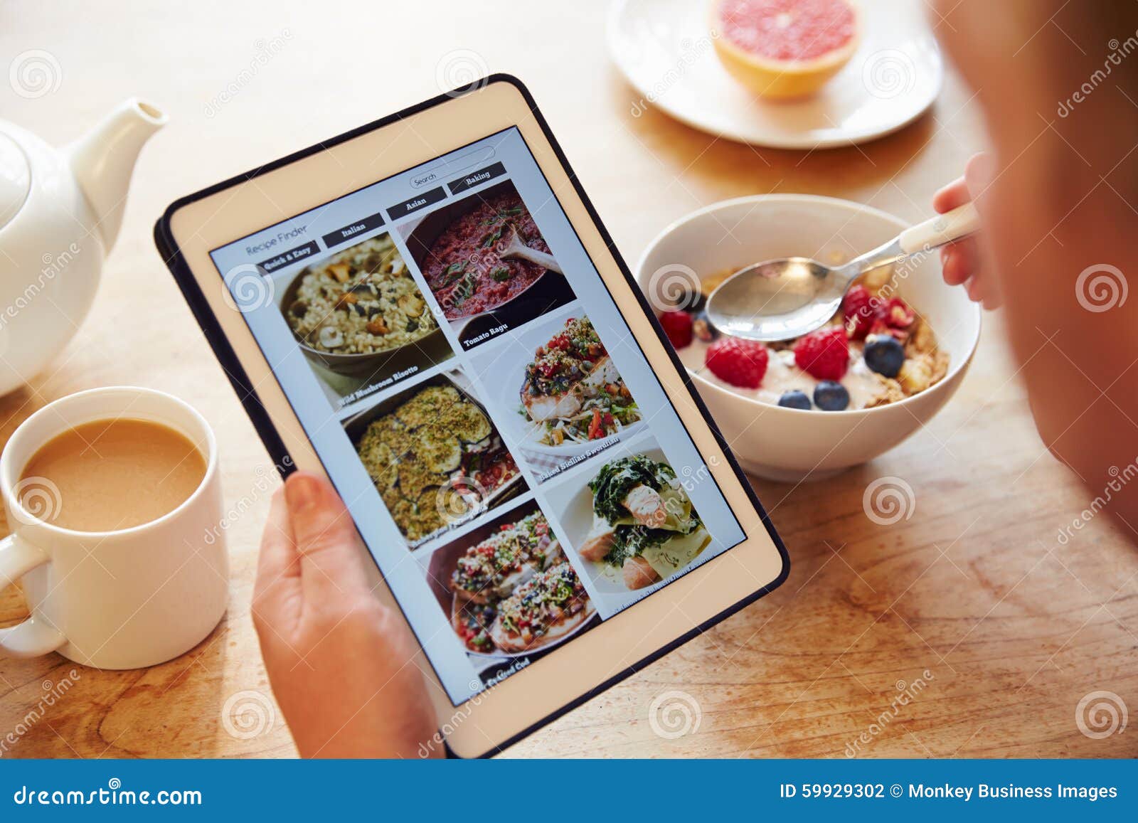 Person at Breakfast Looking at Recipe App on Digital Tablet Stock Photo ...