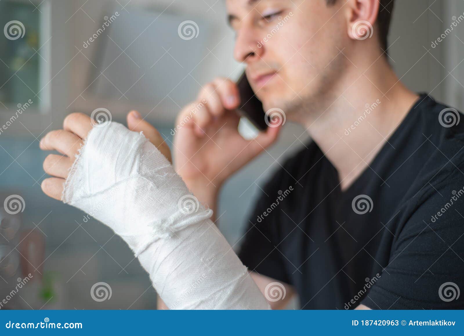 The Person with a Broken Hand Speaks on the Phone. Working As a ...